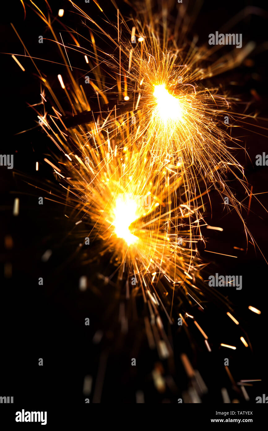 Burning Bengal fire on a black background. Christmas, New Year sparkle ...