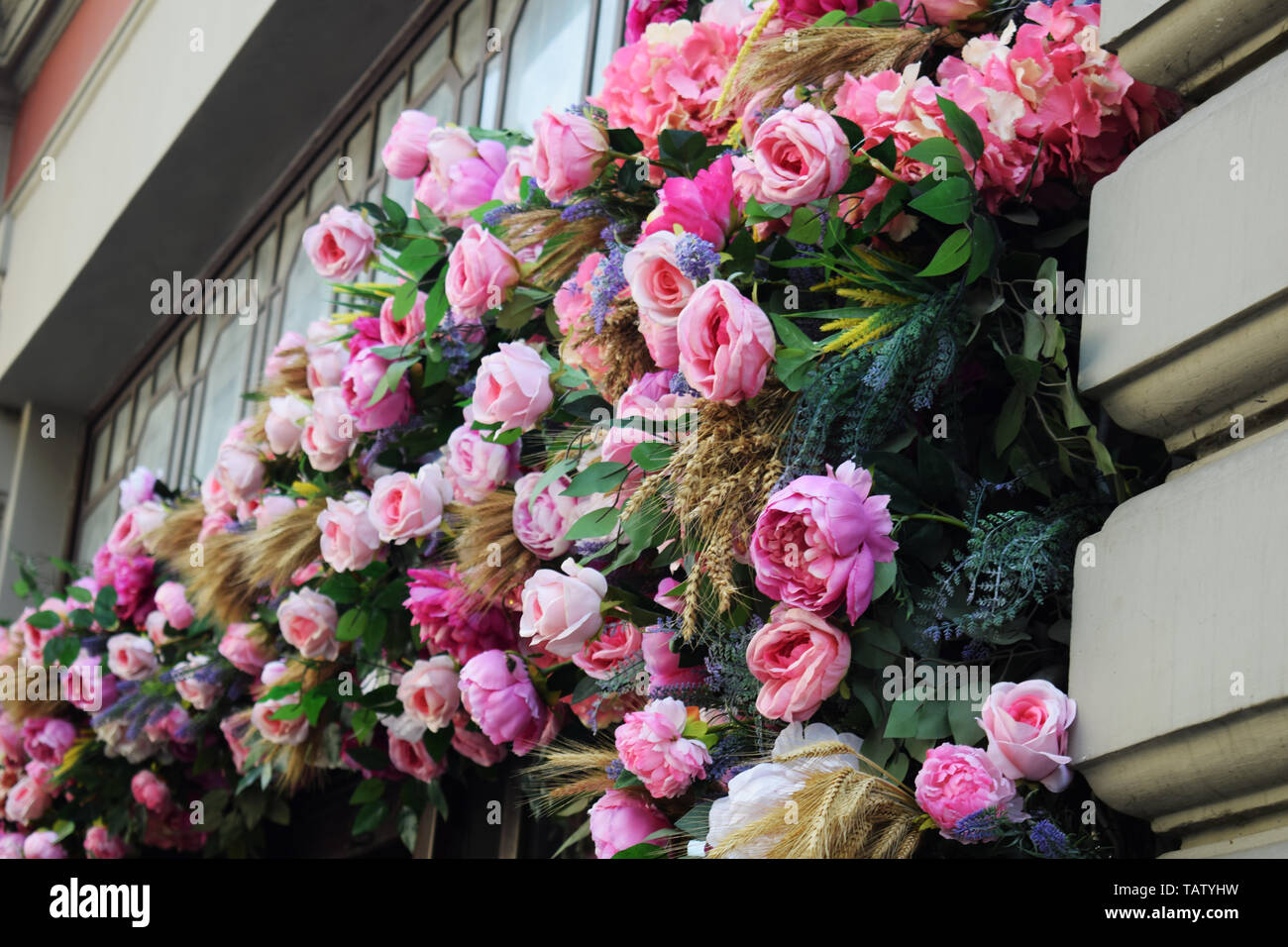 The facade of the building is decorated with flowers Stock Photo - Alamy