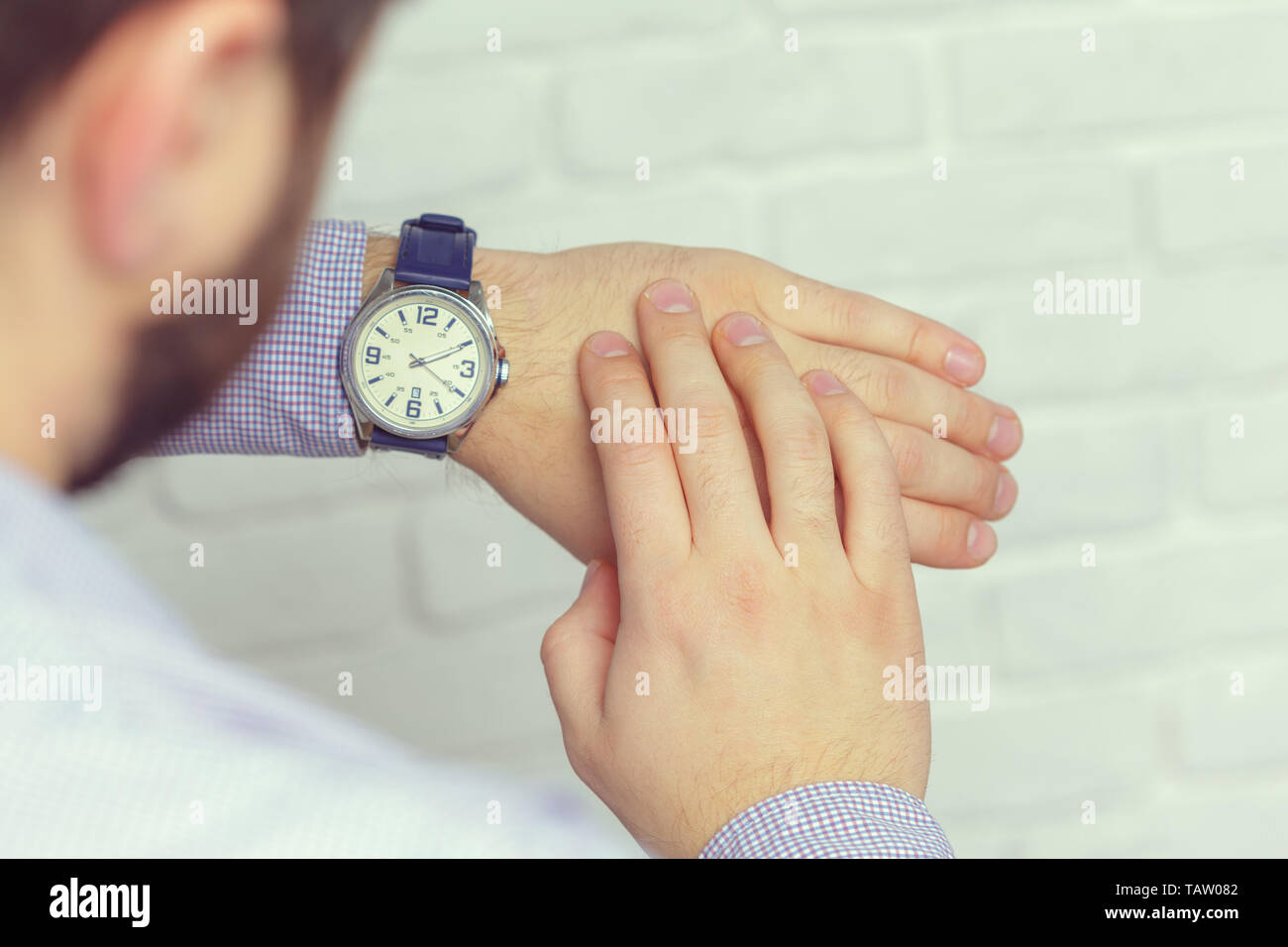 Checks time businessman in hi-res stock photography and images - Alamy