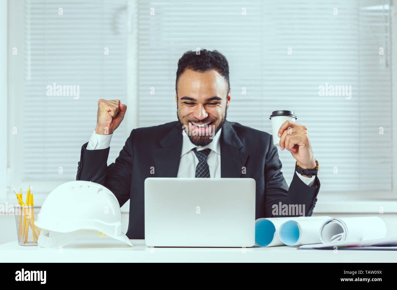 architect sitting at desk and working Stock Photo - Alamy
