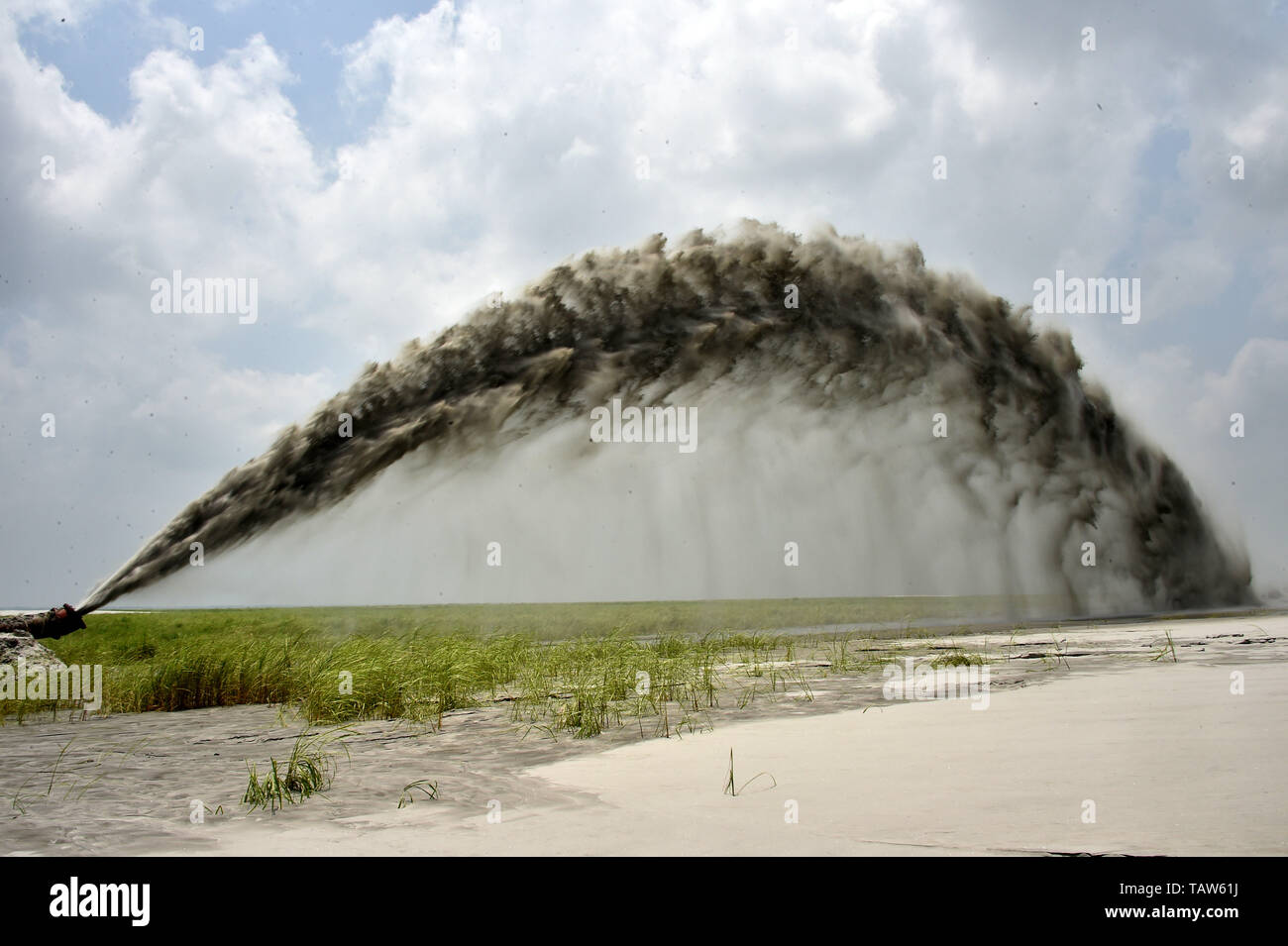 Shariatpur, Ltd. spews muddy water after extraction from a channel of ...