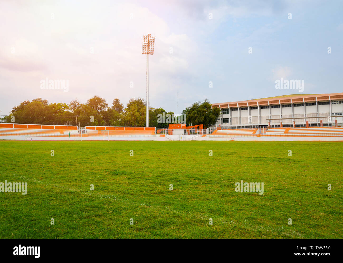 Green grass sports outdoor football field with running track Athletics ...