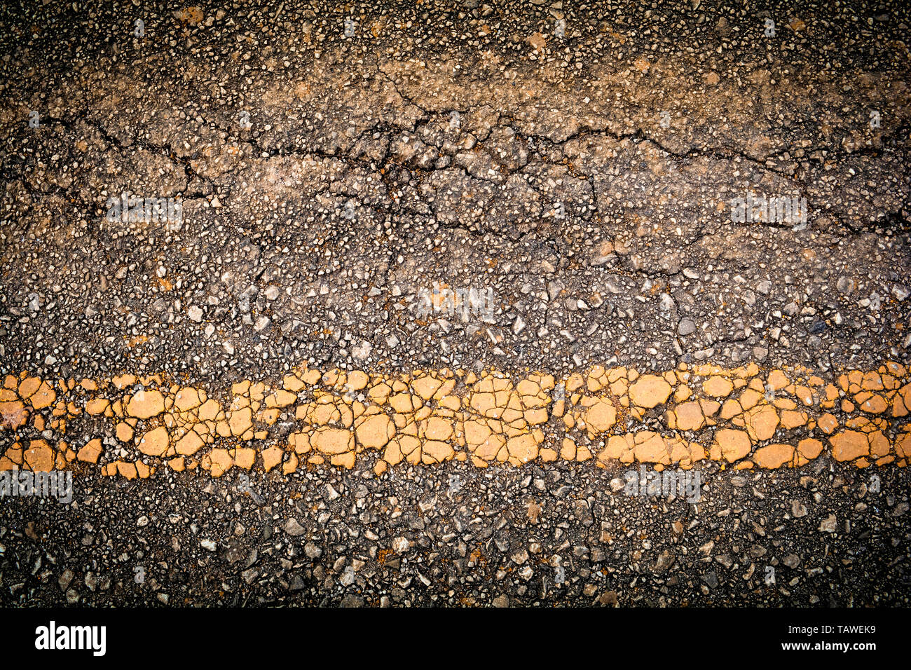 Crack asphalt old road texture background with yellow line Stock Photo ...