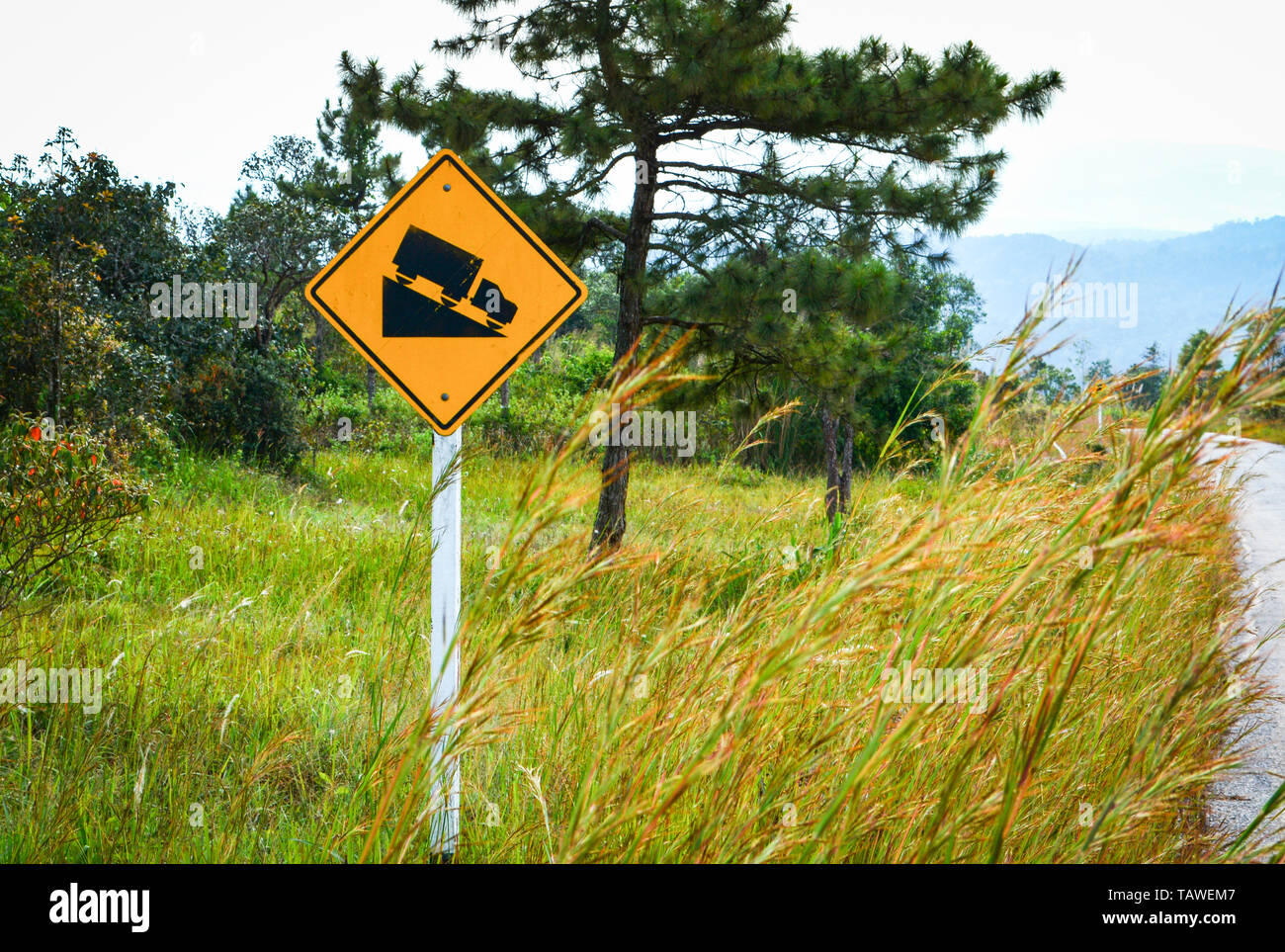 Road sign Steep Slope warning traffic and truck on hill mountain Stock ...