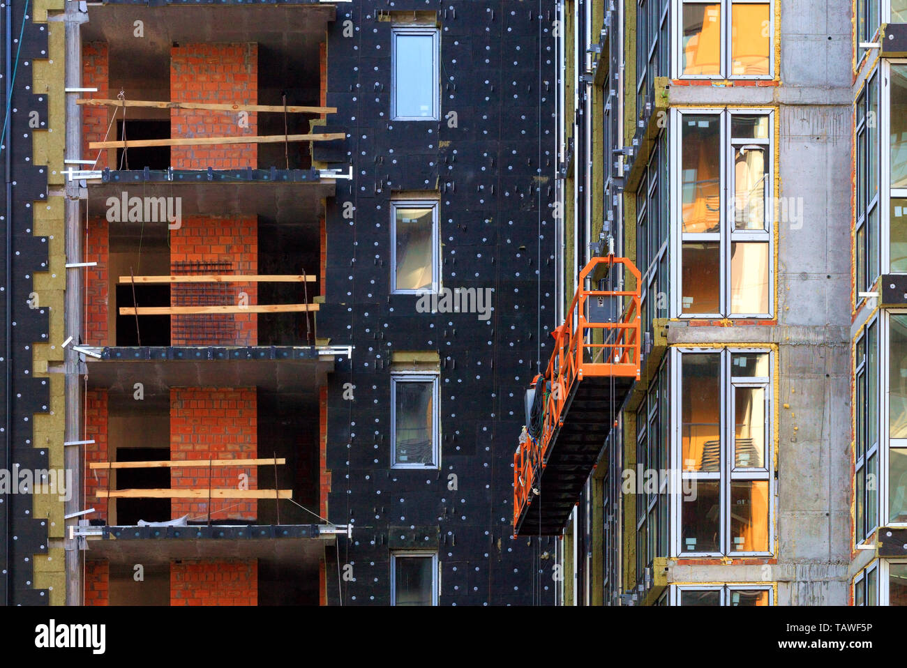 Fragment of the facade and insulation of a house under construction ...