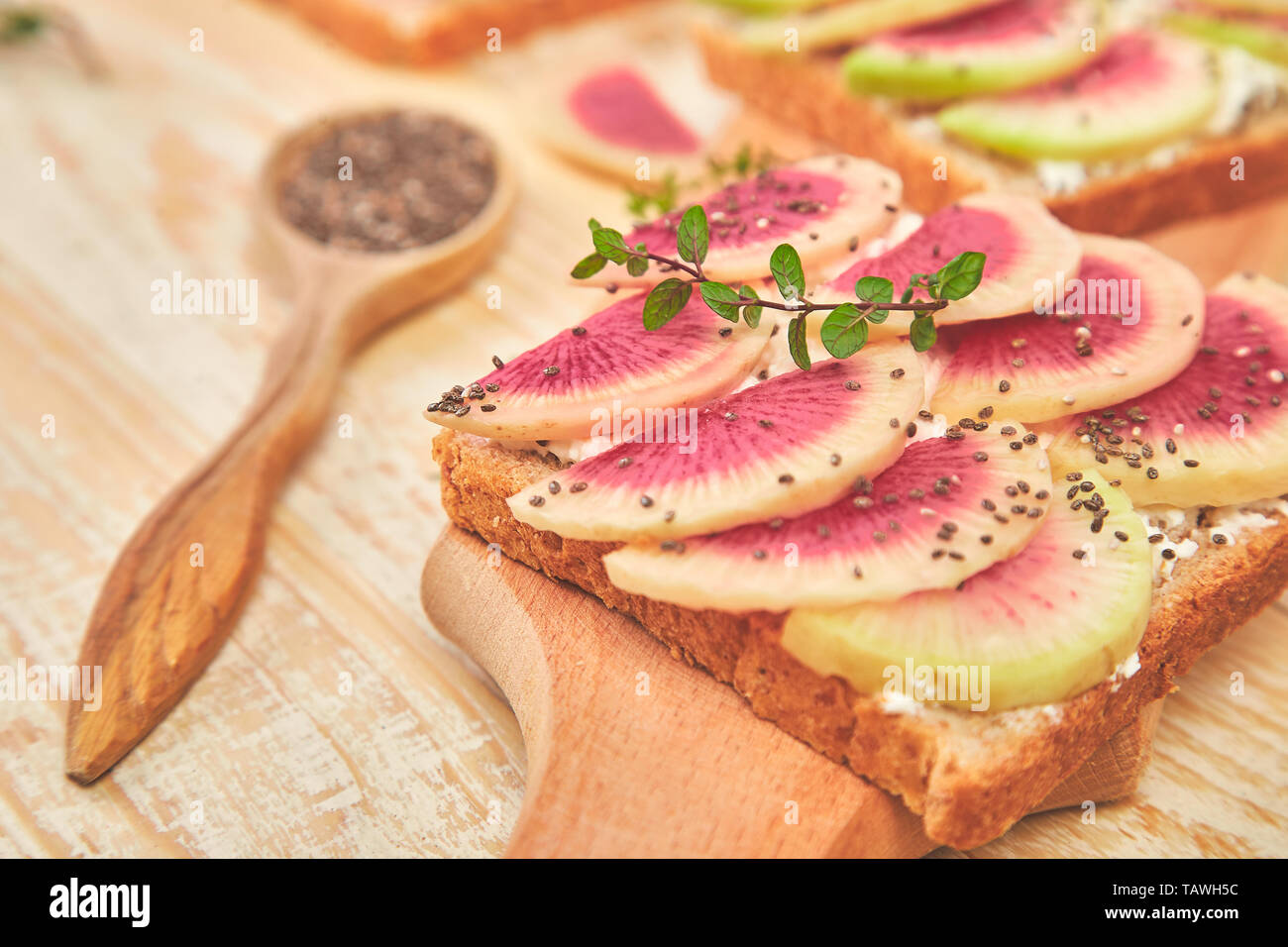 Healthy breakfast toasts from sliced watermelon radish or chinese ...
