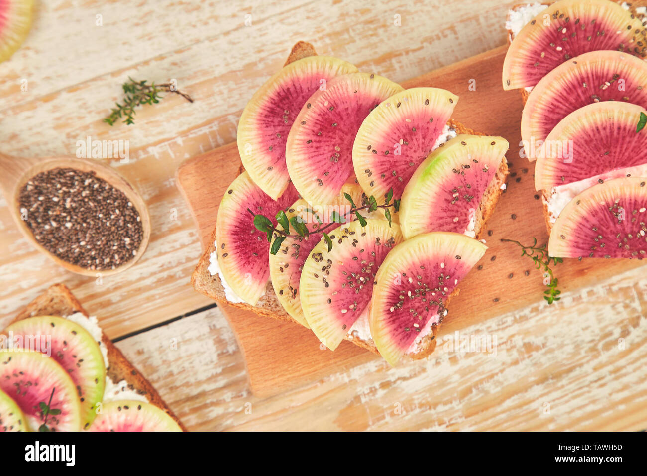 Healthy breakfast toasts from sliced watermelon radish or chinese ...