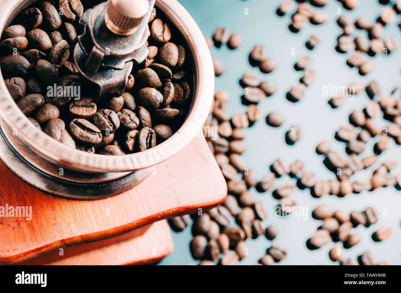 Coffee grinder with coffee beans on the reflective surface. Making ...
