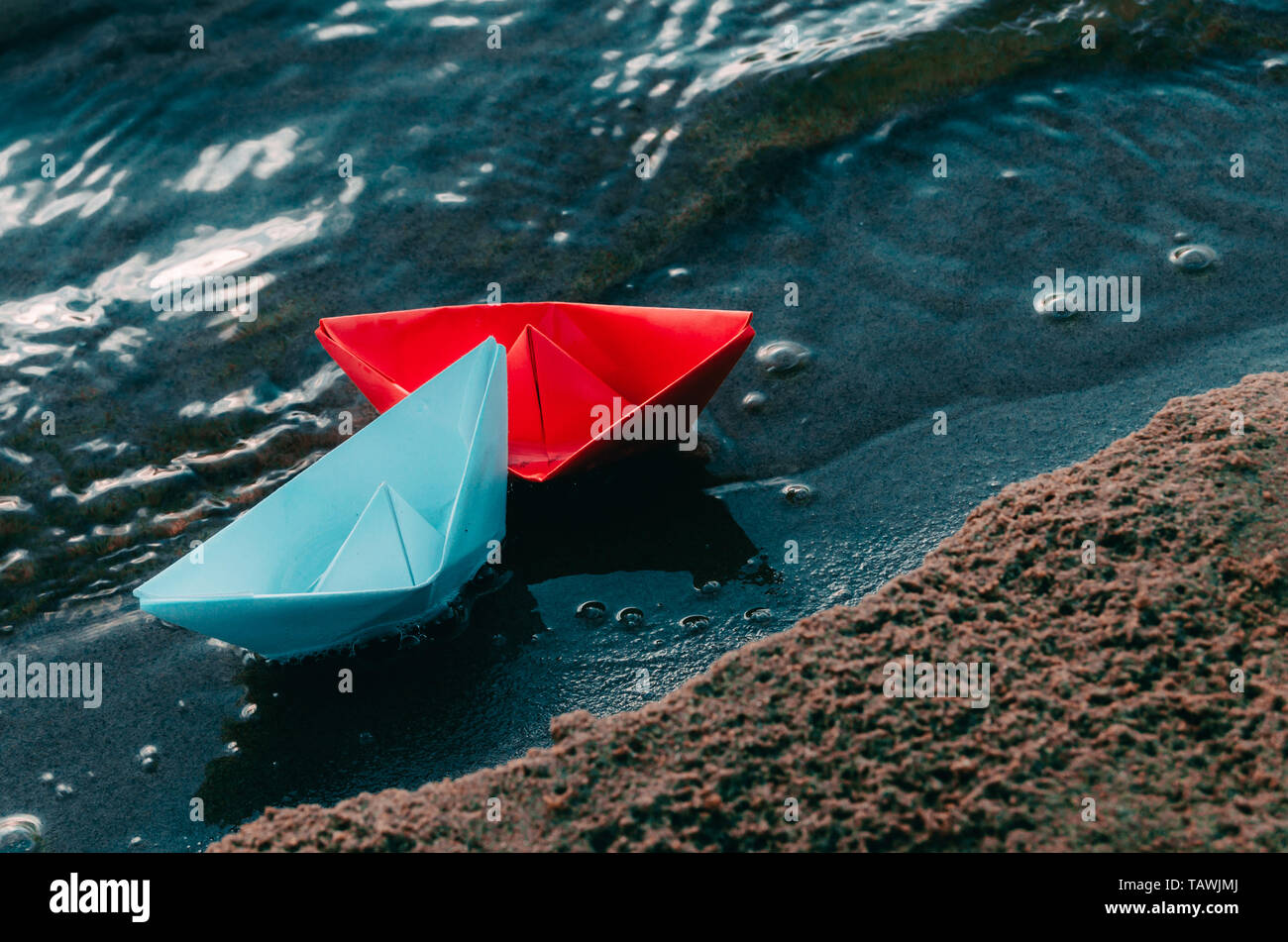 Small,red,paper boat is shipwrecked in a turbulent raging sea Stock ...