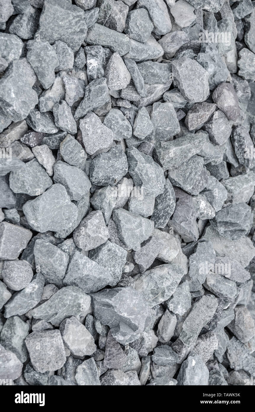 Crushed grey stone on the ground texture background Stock Photo - Alamy