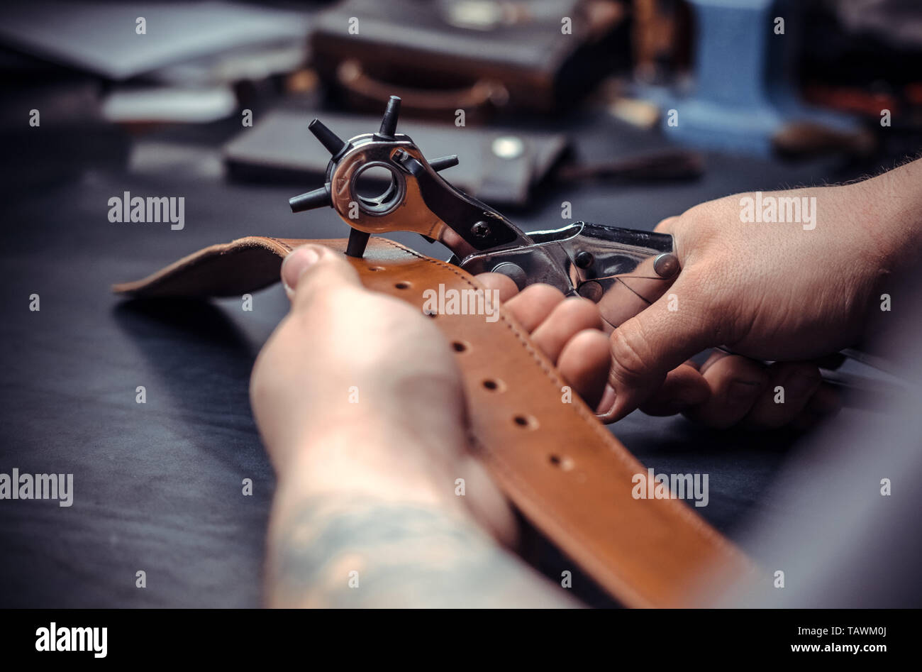Currier cutting out leather goods in his workshop Stock Photo - Alamy