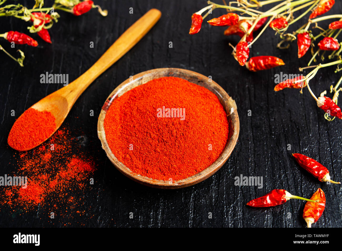 Grounded red pepper in a bowl top view Stock Photo - Alamy