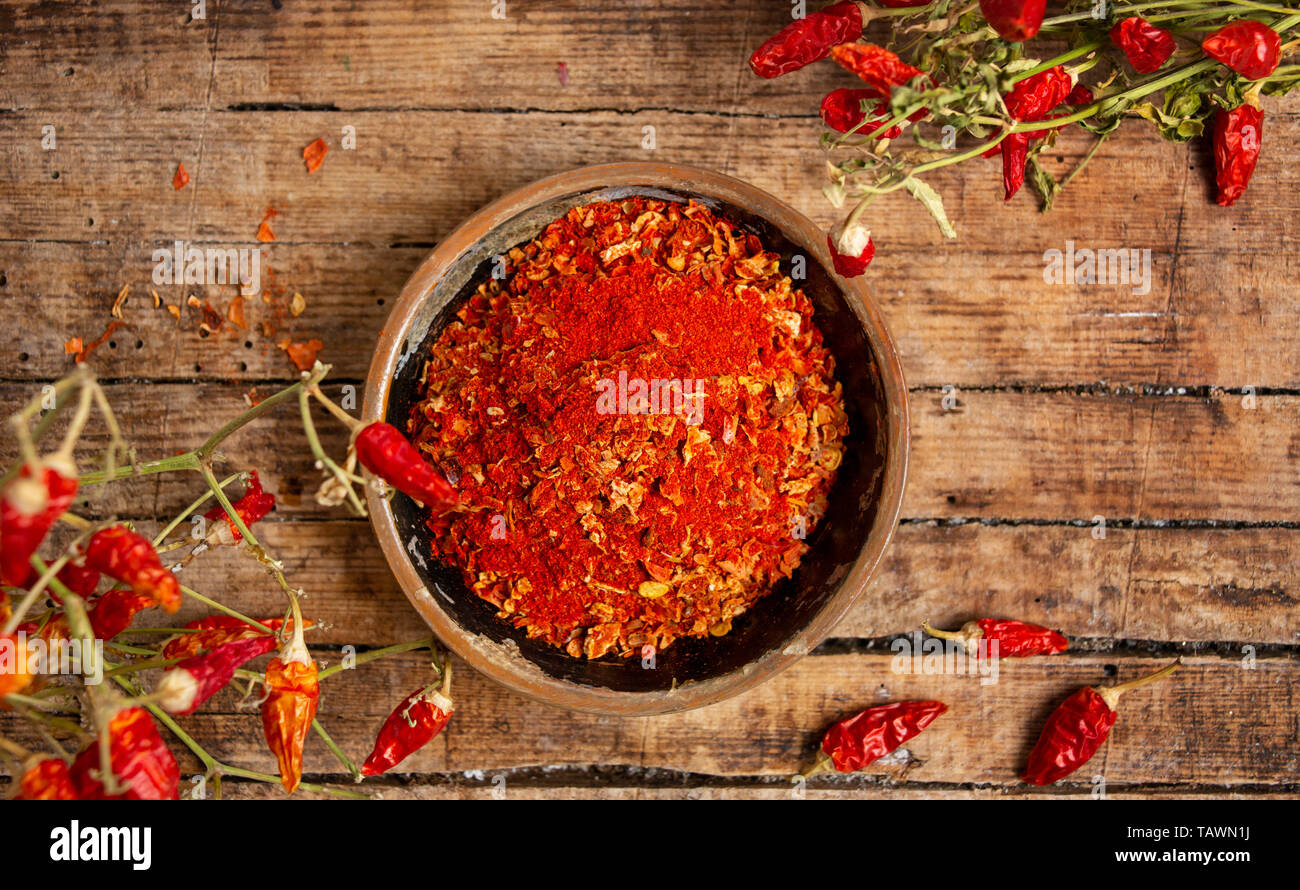 Grounded red pepper in a bowl top view Stock Photo - Alamy