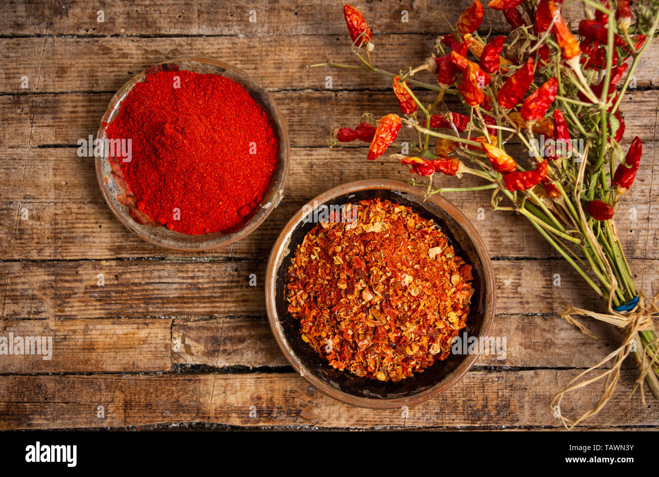 Grounded red pepper in a bowl top view Stock Photo - Alamy