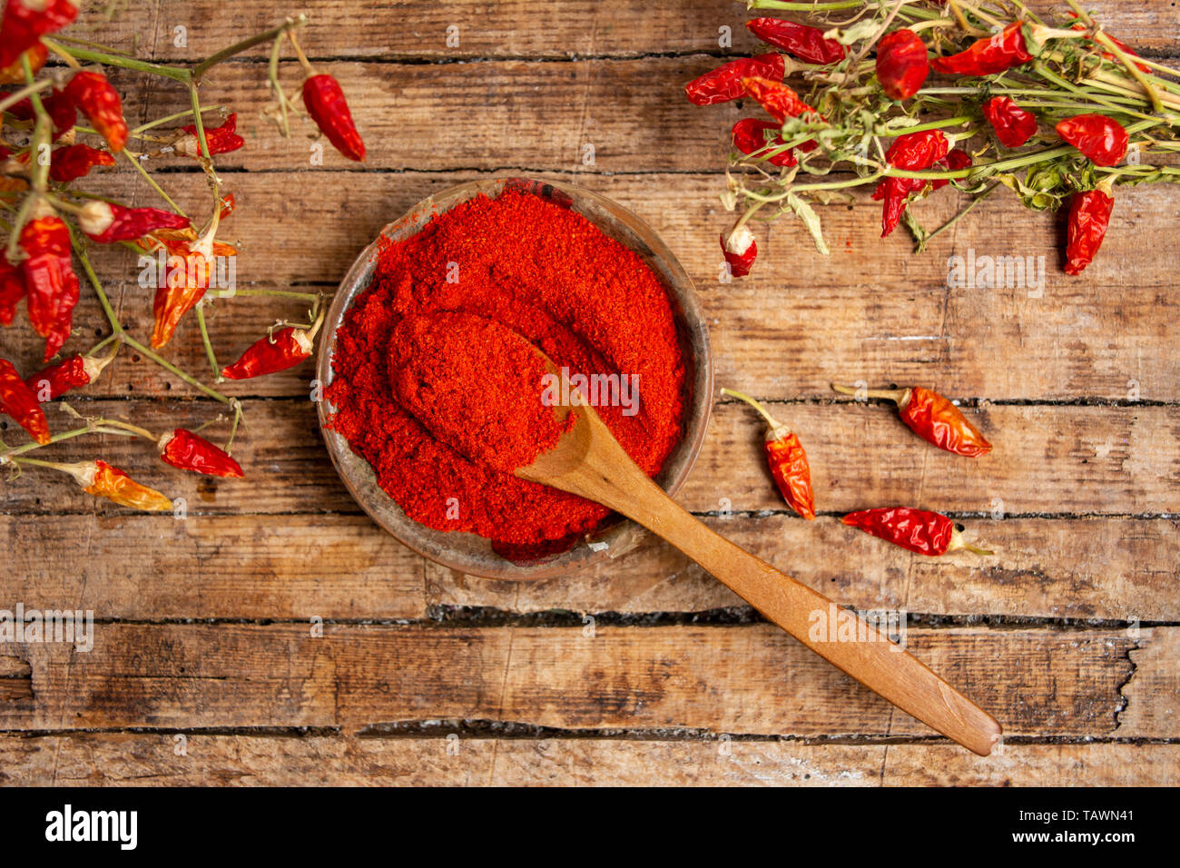 Grounded red pepper in a bowl top view Stock Photo - Alamy