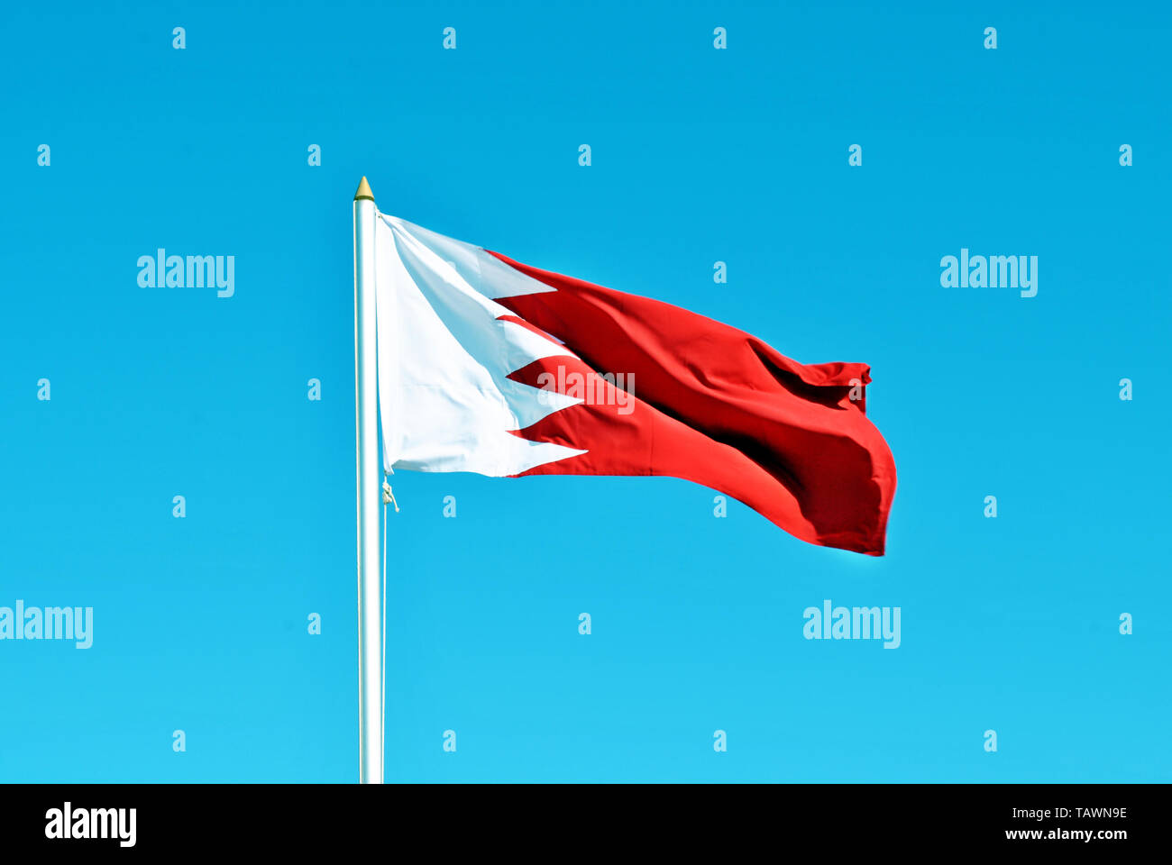 Bahrain flag waving with nice blue sky isolated Stock Photo - Alamy