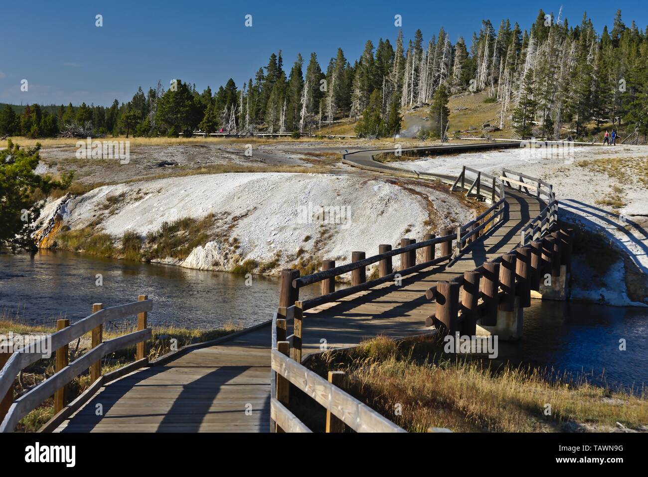 A walkway, bridge with wooden rails across Yellowstone river Stock ...