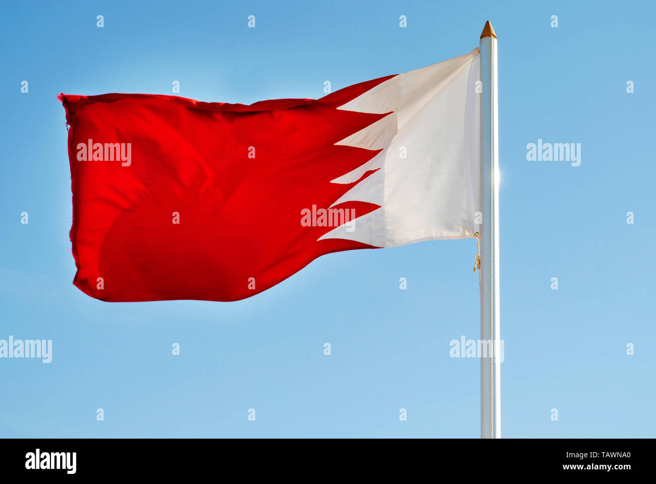 Bahrain flag waving with nice blue sky isolated Stock Photo - Alamy