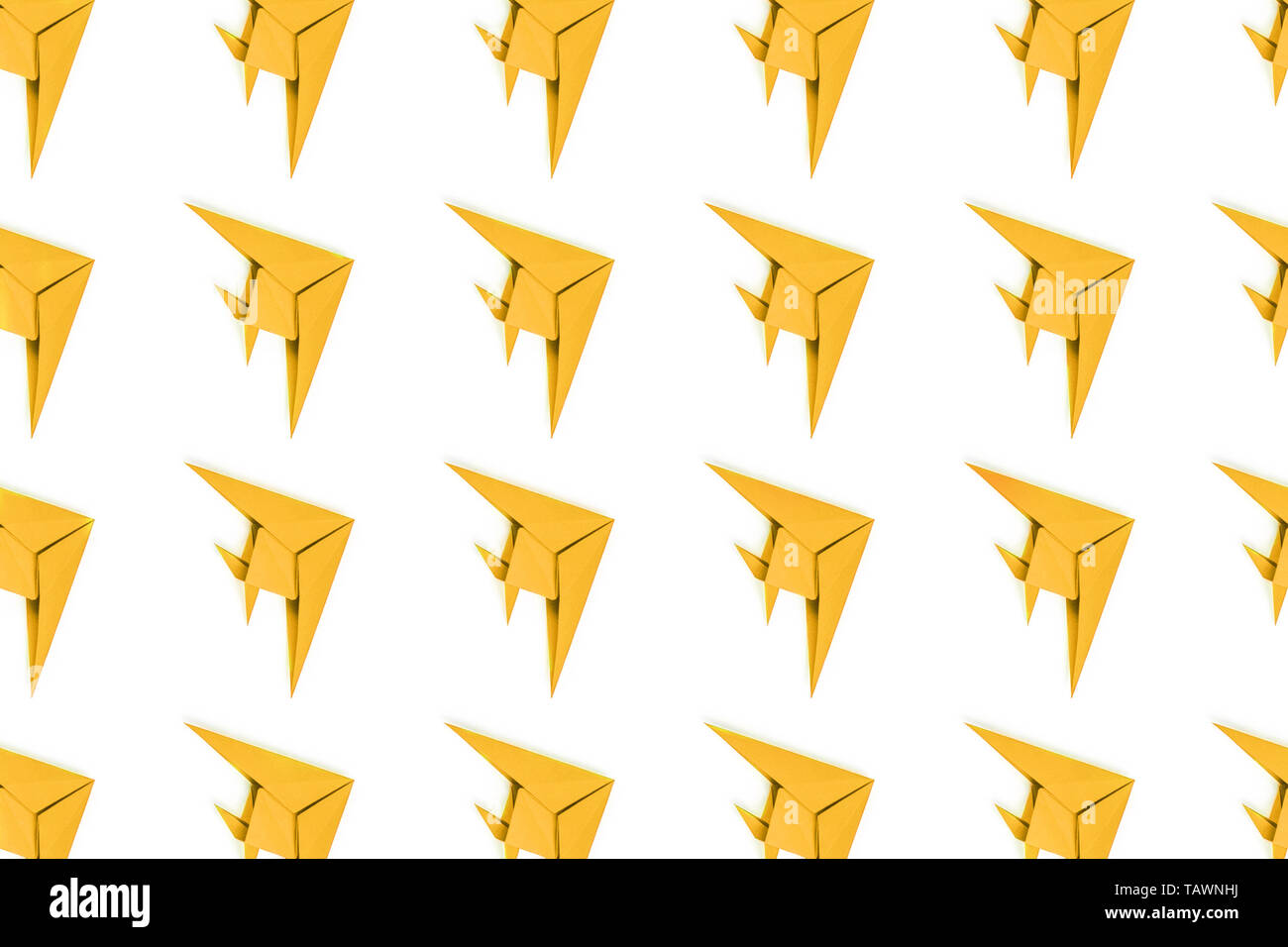 Pattern of yellow paper origami fishes isolated on white background ...