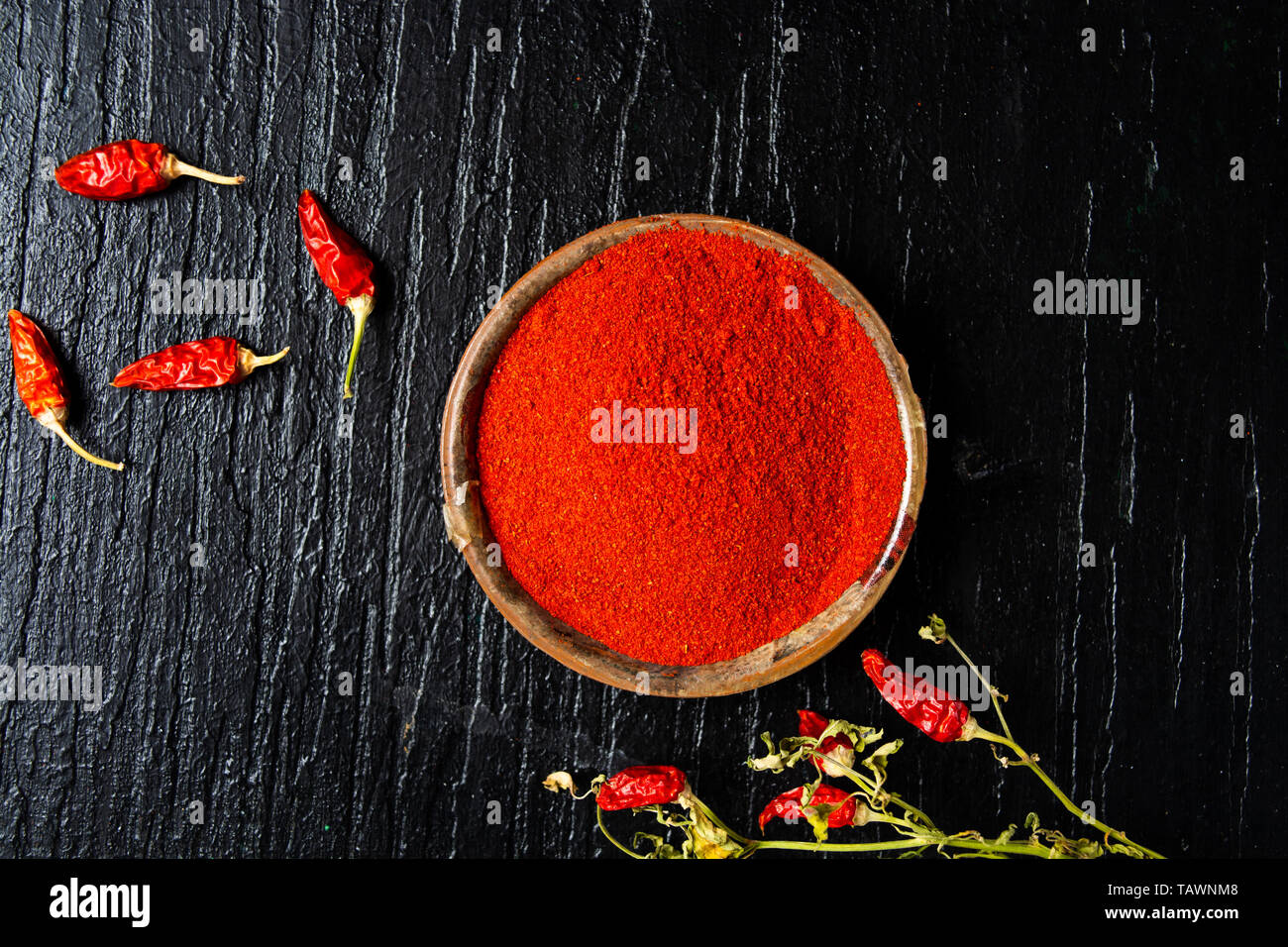 Grounded red pepper in a bowl top view Stock Photo - Alamy