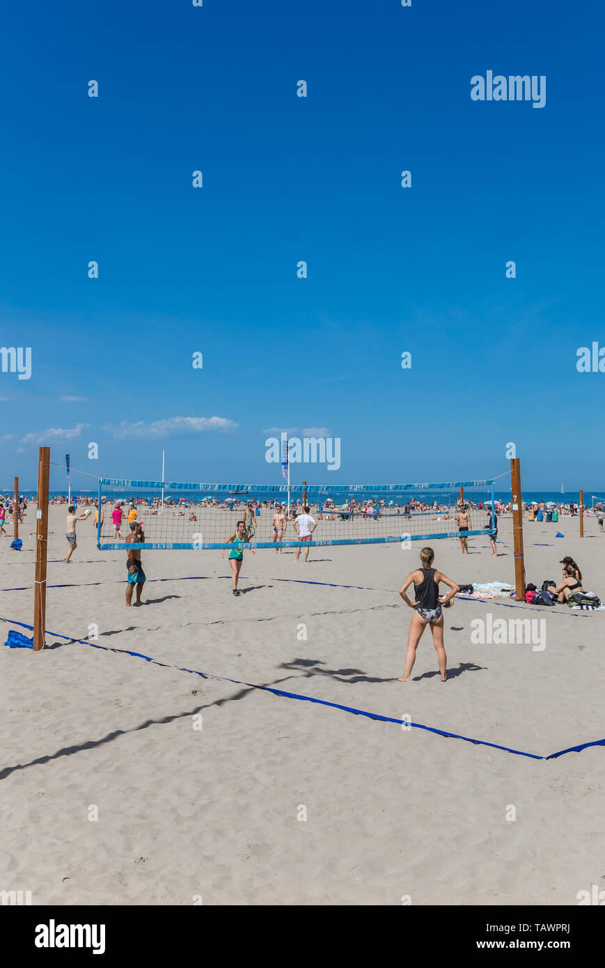 People playing volleyball on the beach of Valencia, Spain Stock Photo ...