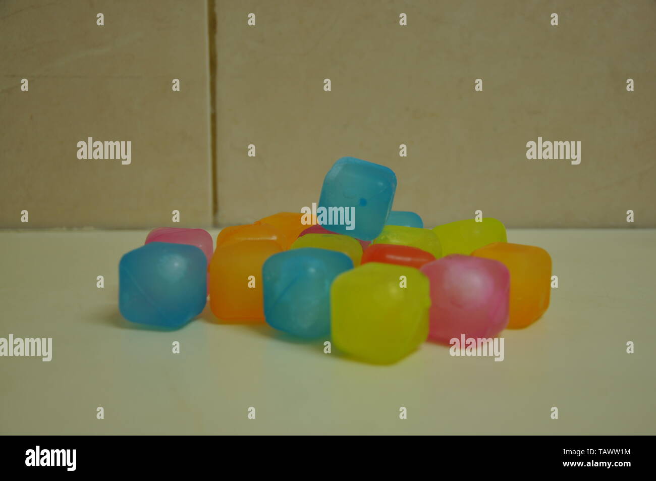 Plastic ice cubes of different colors Stock Photo - Alamy