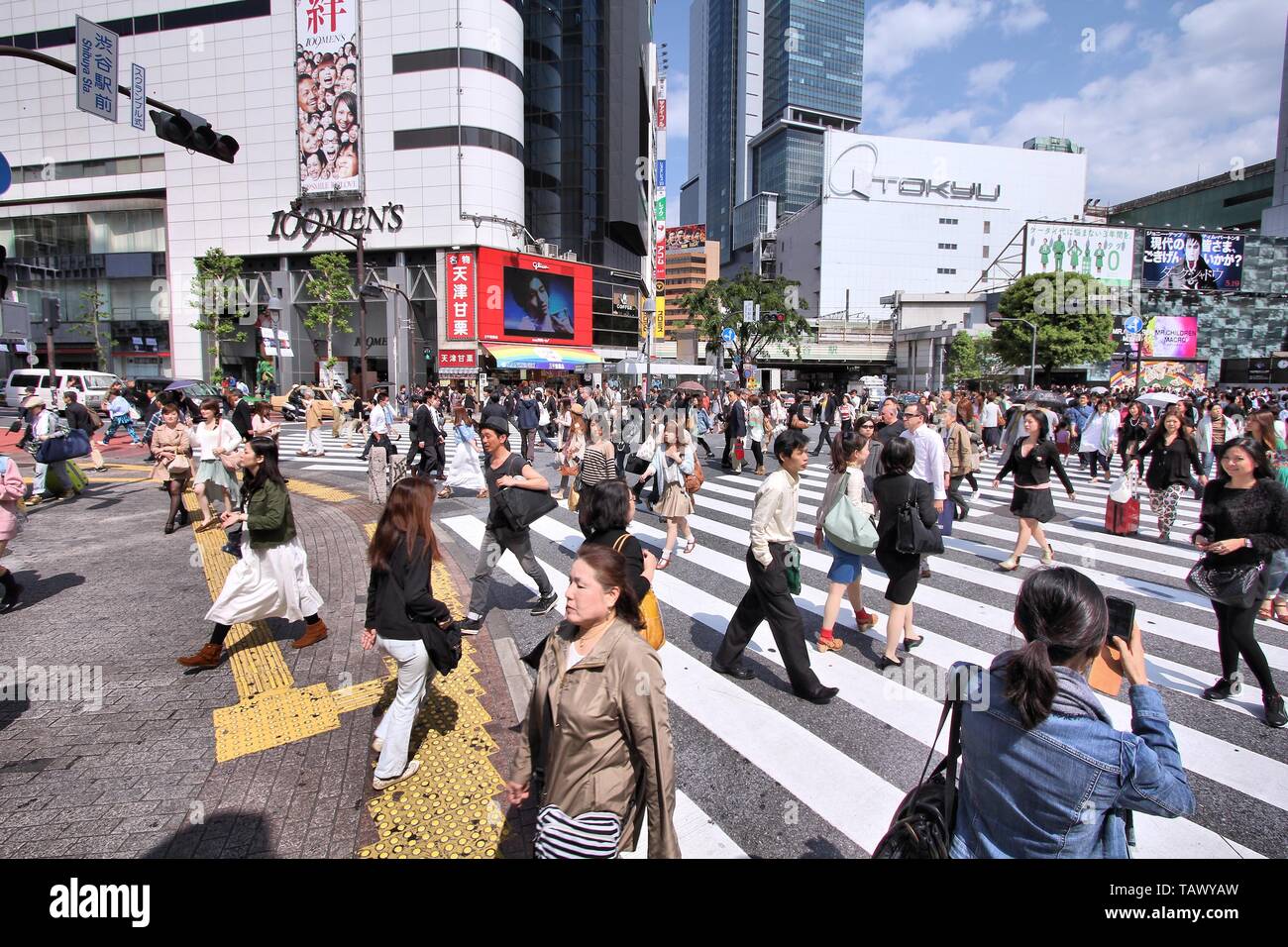 TOKYO, JAPAN - MAY 11, 2012: People walk the Hachiko crossing in ...