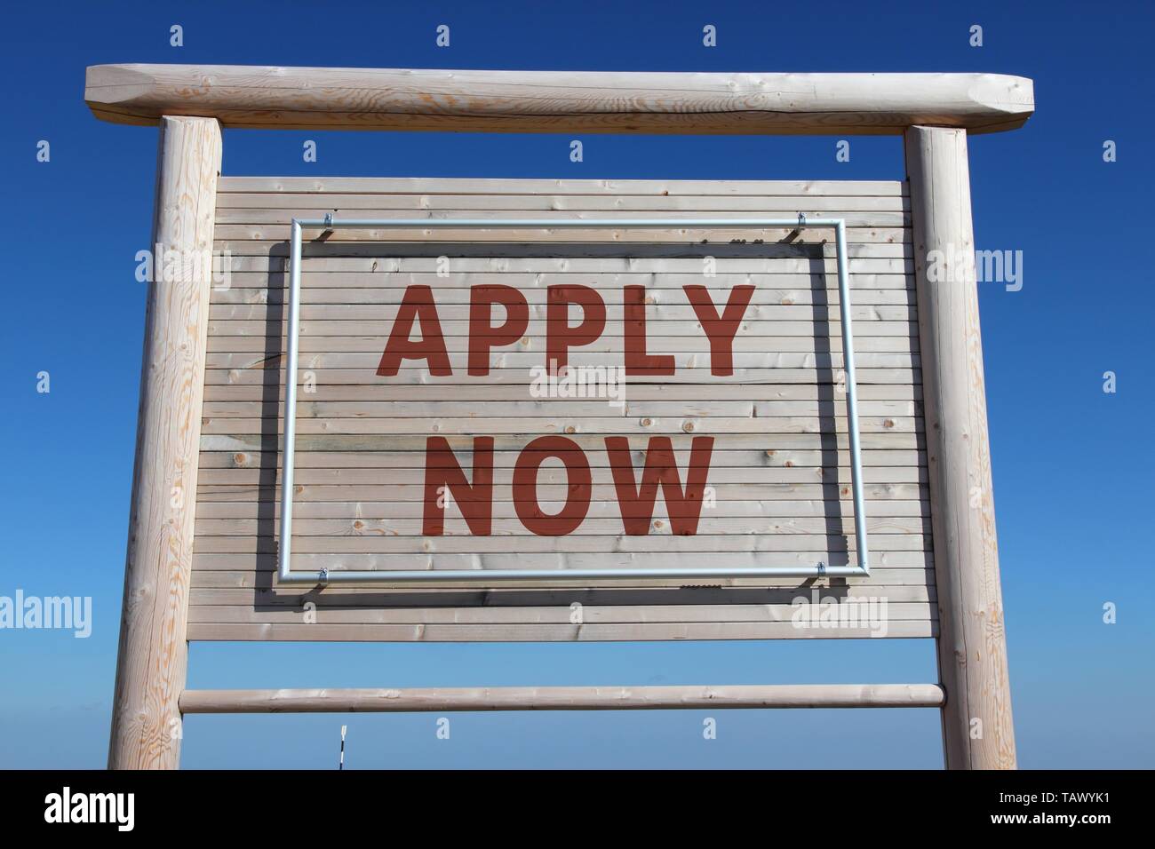 Apply now - wooden business sign with career message Stock Photo - Alamy