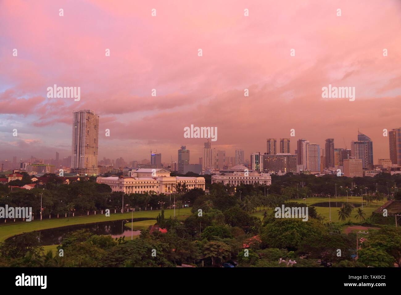 Manila city skyline in sunset light in Philippines. Ermita and Paco ...