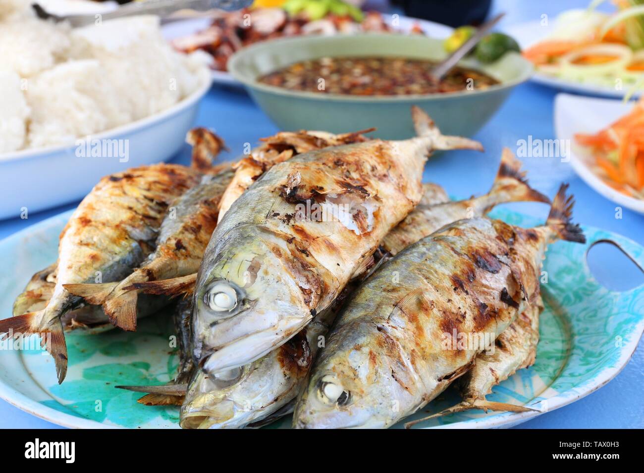 Barbecued fish lunch in Philippines boat tour Stock Photo - Alamy