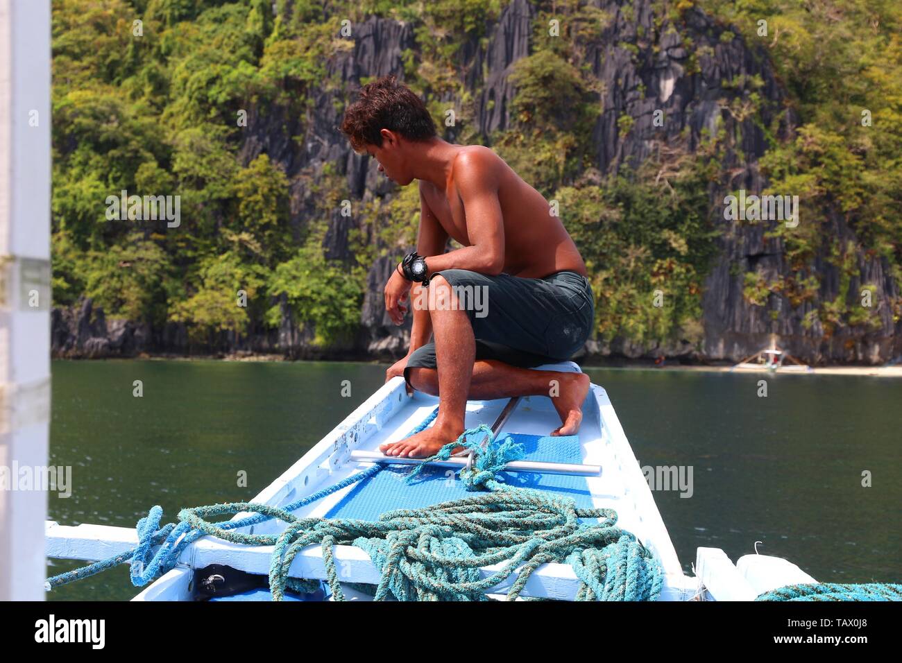 PALAWAN, PHILIPPINES - DECEMBER 4, 2017: Local guide and diver on ...