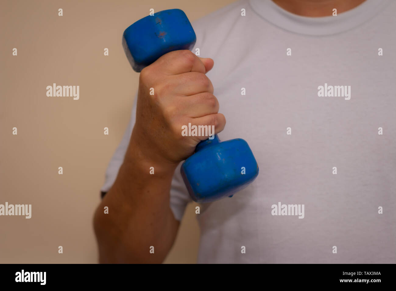 Man exercising in the gym. Exercises to tone muscles. Concept of health ...