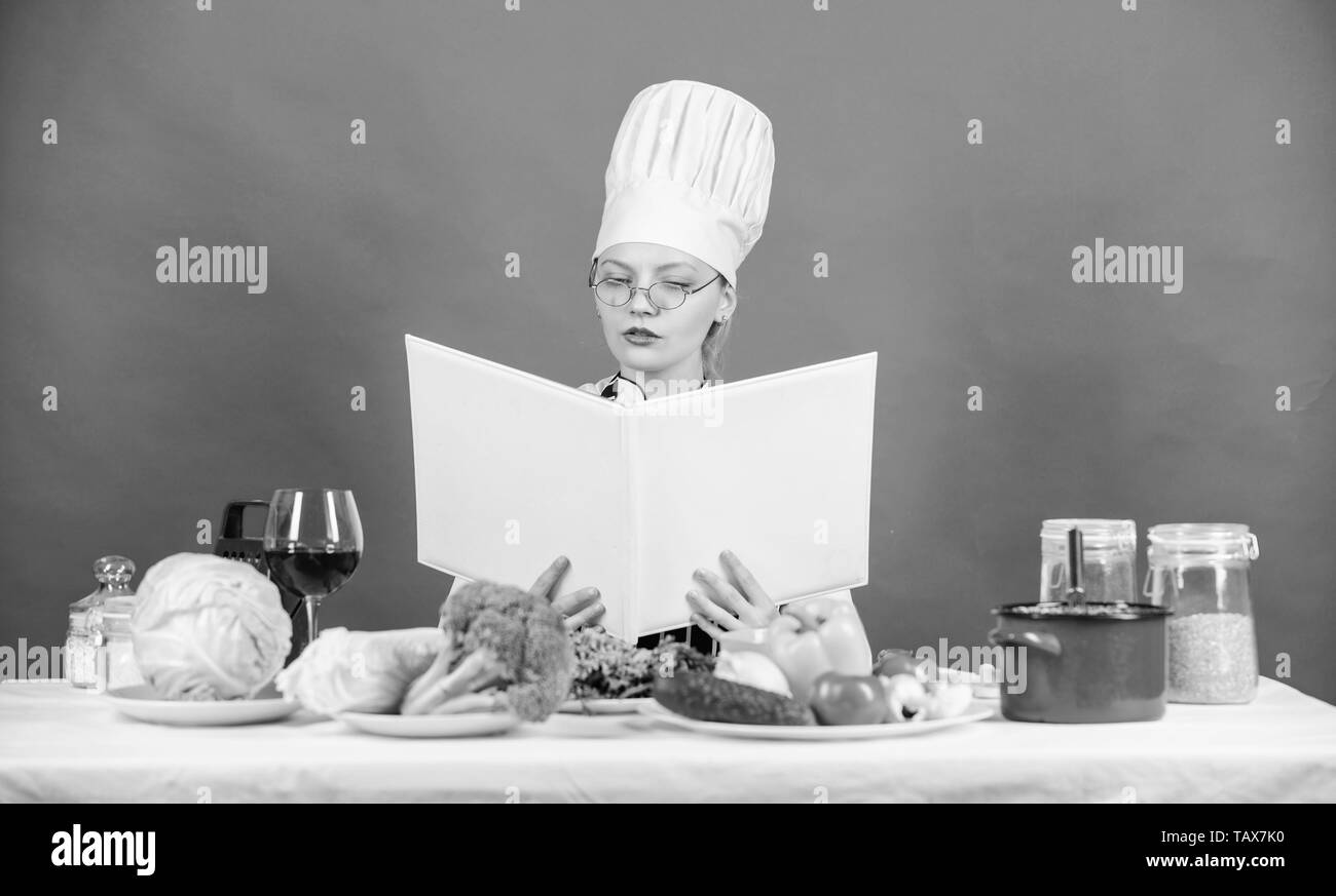 Culinary school concept. Female in hat and apron knows everything about ...