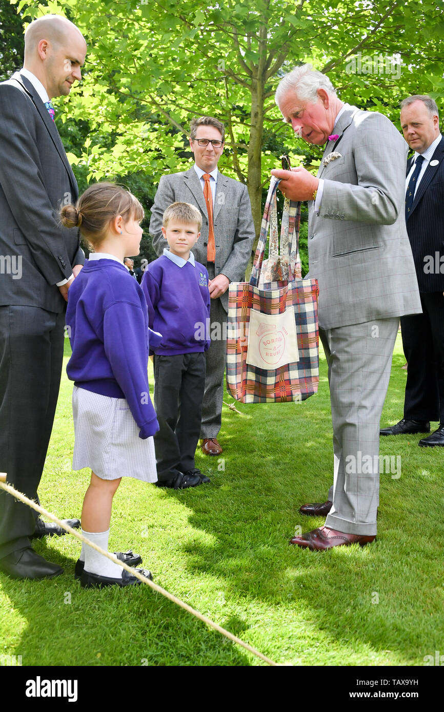 The Prince of Wales receives a boomerang repurposed bag by Austin ...