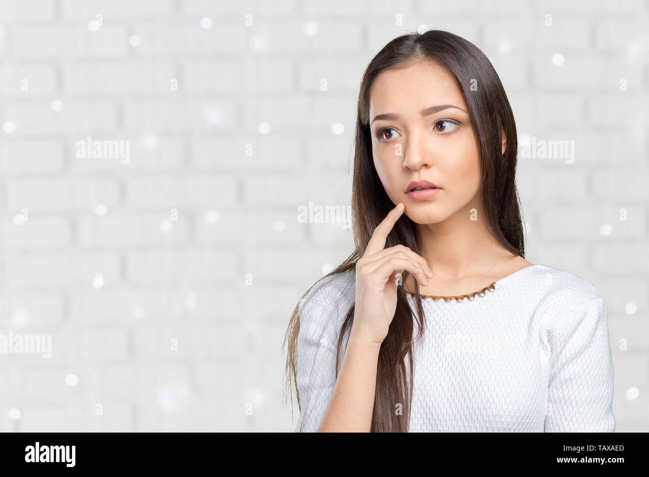 Asian woman thinking Stock Photo - Alamy