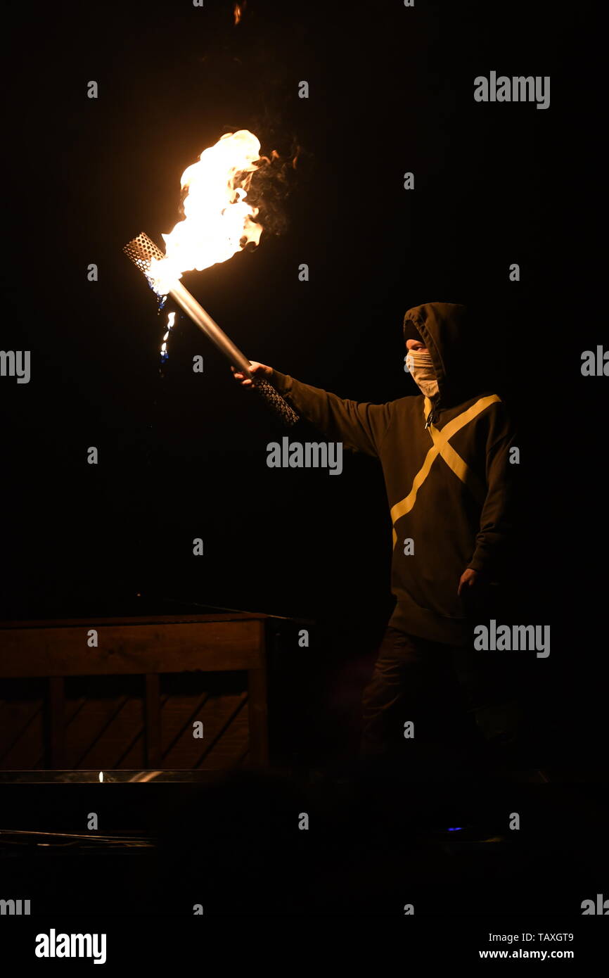Drummer Josh Dun is shown performing on stage during a "live" stand up ...