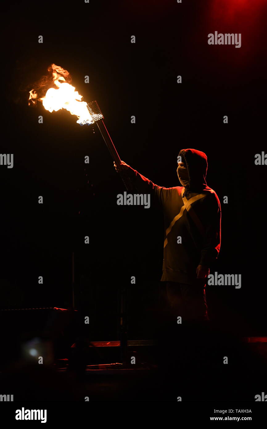 Drummer Josh Dun is shown performing on stage during a "live" stand up ...