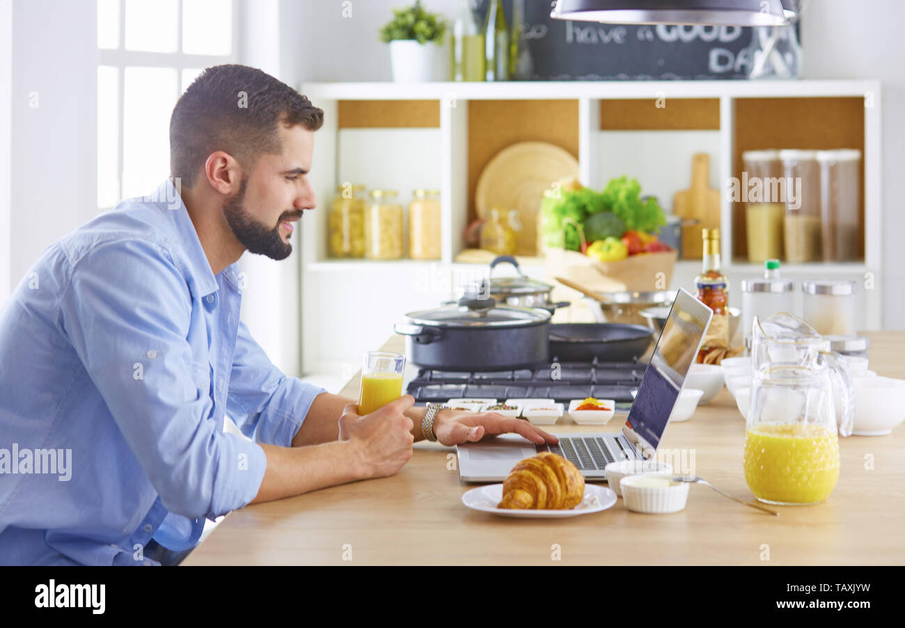 a business man breakfasts with notebook and juice Stock Photo - Alamy