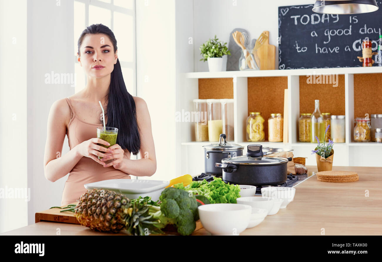 a young girl drinks a cocktail on a kitchen Stock Photo - Alamy
