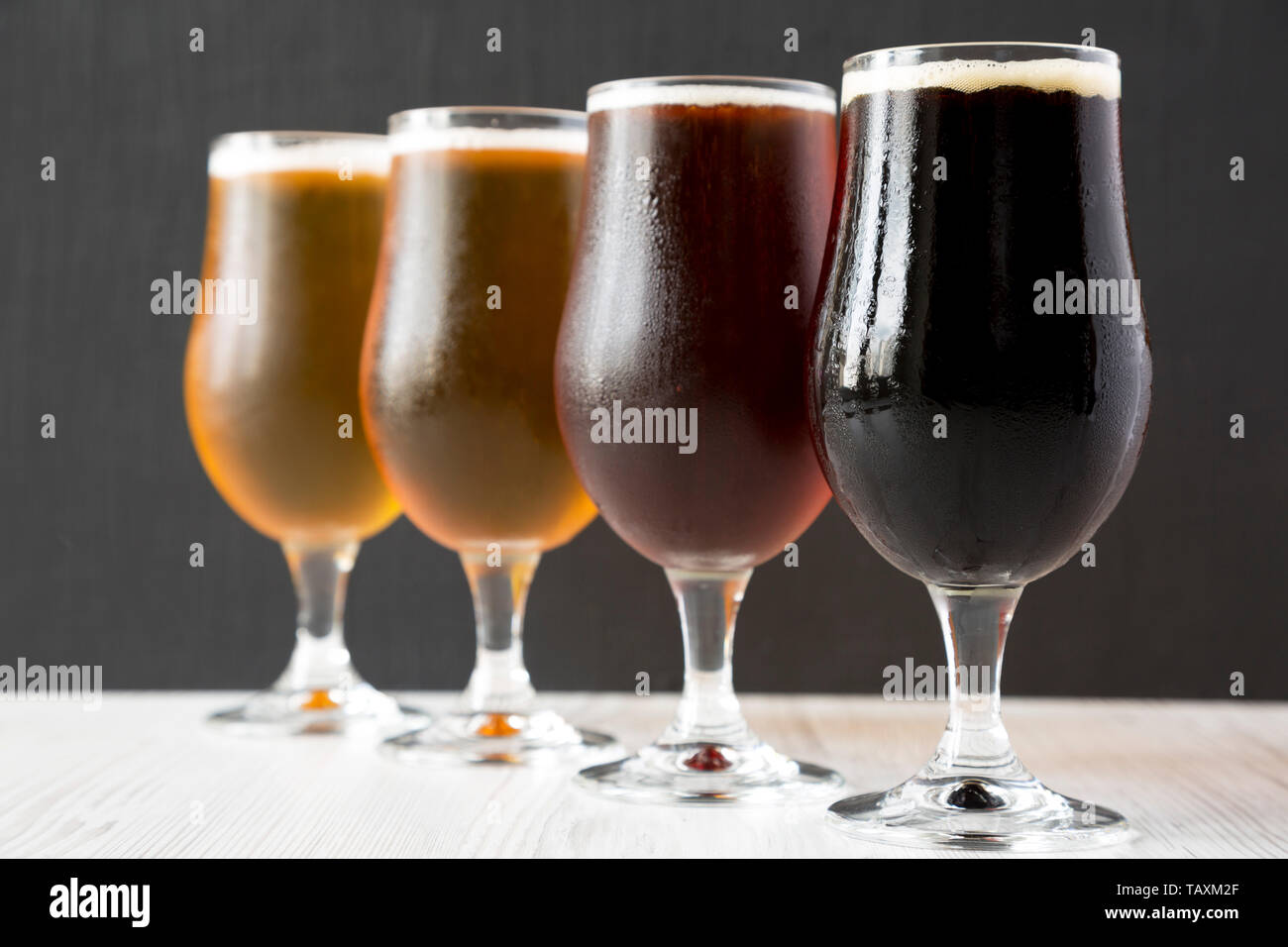 Different beers, side view. Close-up Stock Photo - Alamy