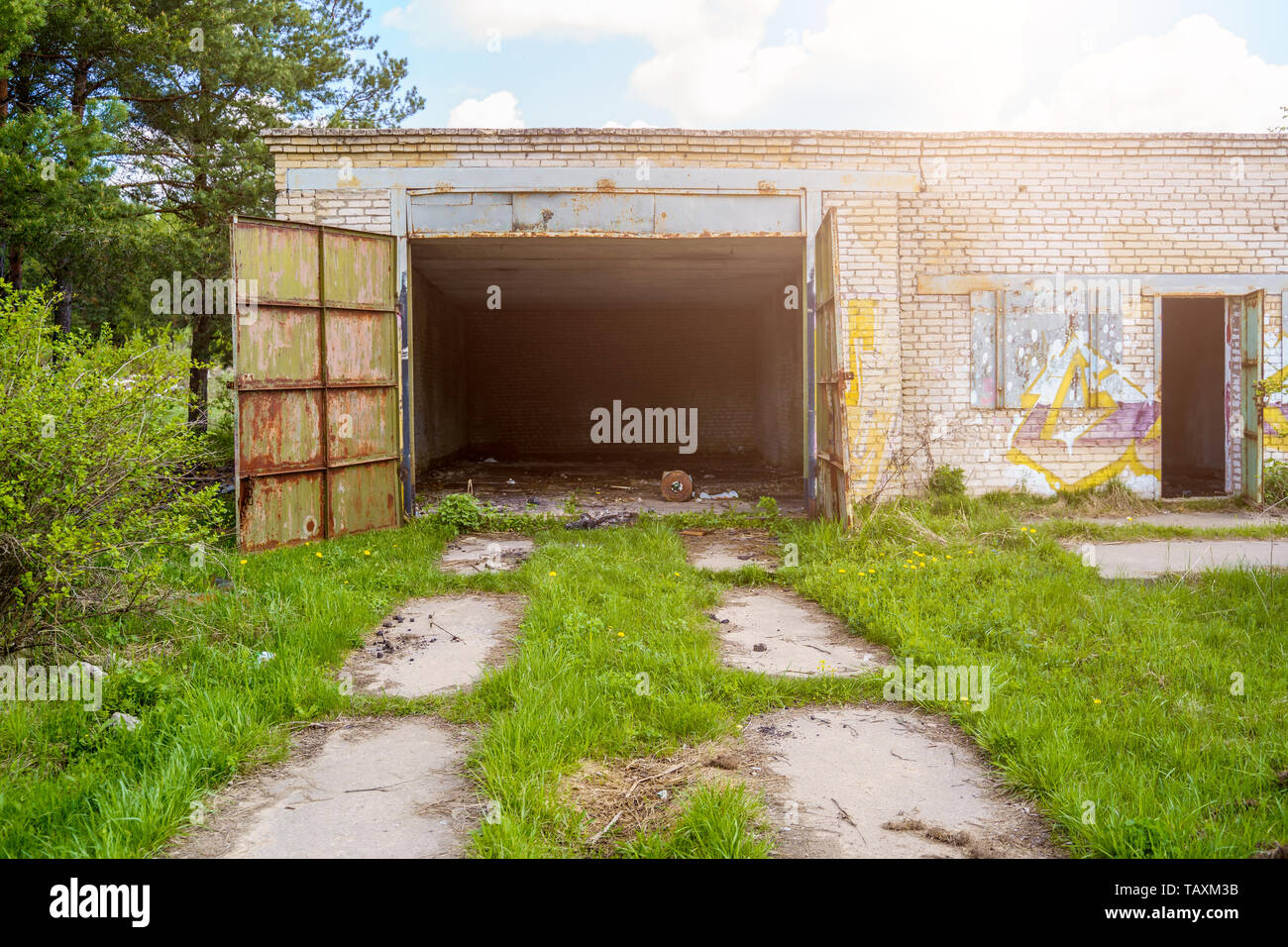 Photo of brick garage with open doors Stock Photo - Alamy