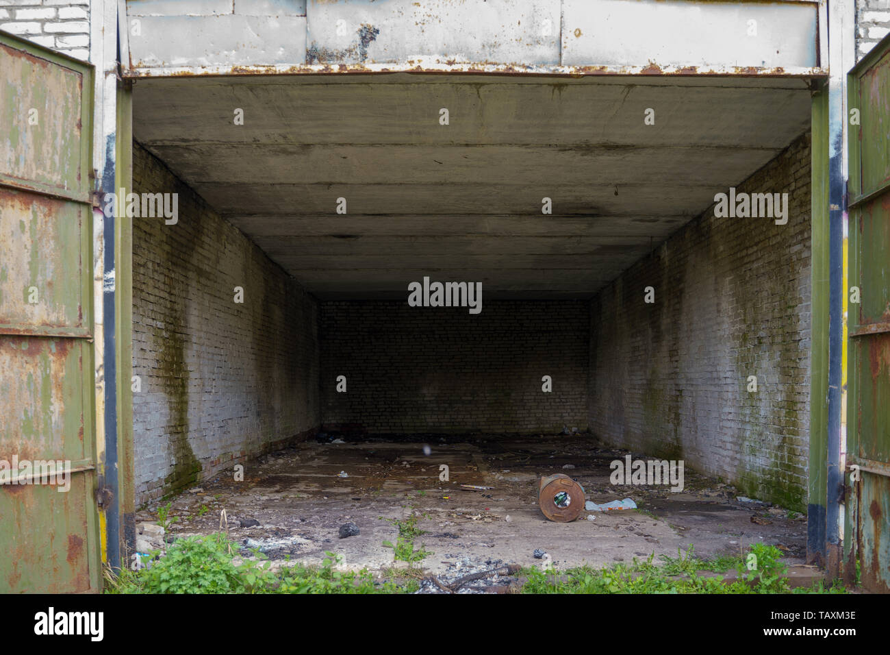 Picture of brick garage with open doors Stock Photo - Alamy