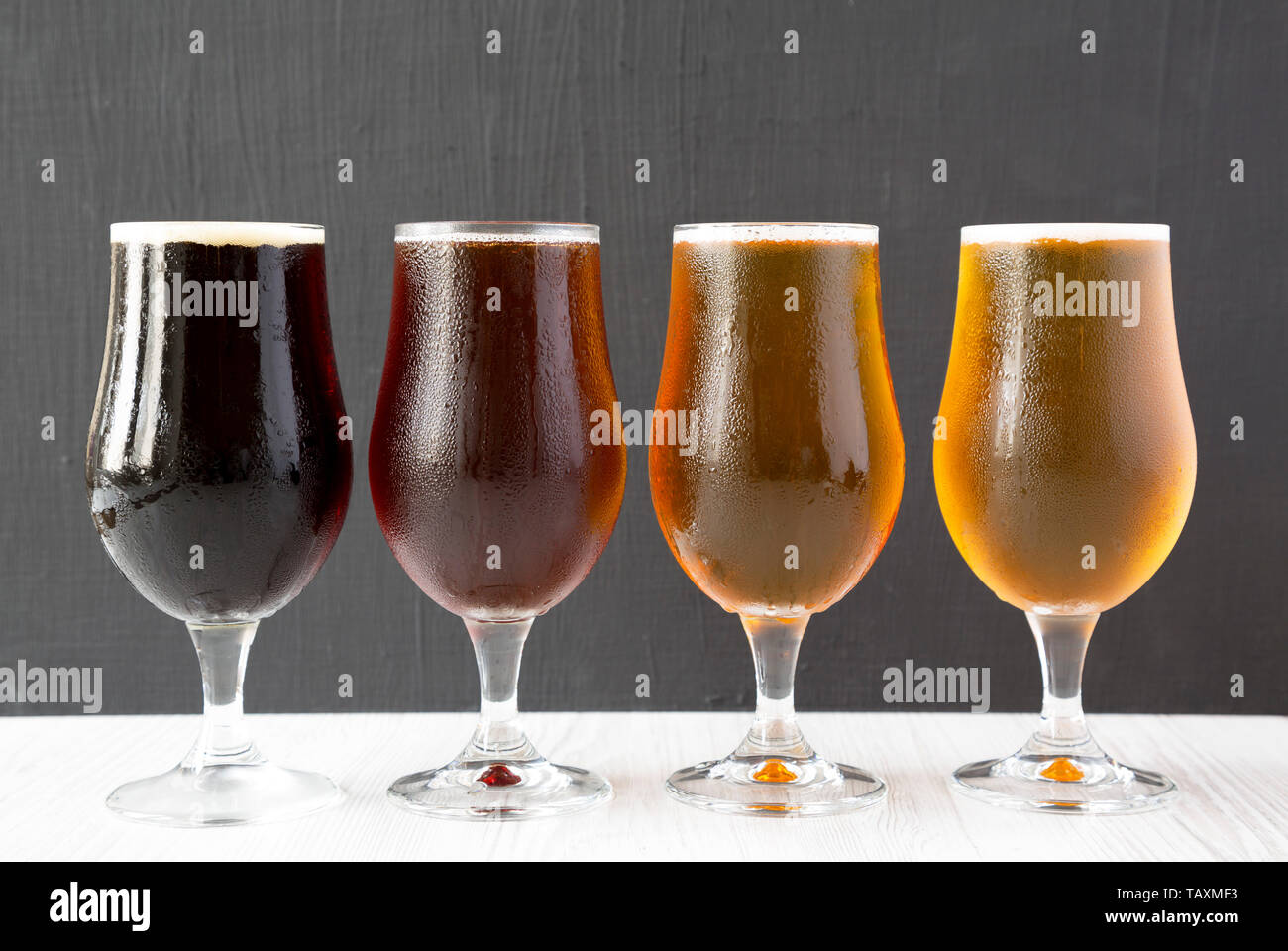Cold craft beer assortment, side view. Close-up Stock Photo - Alamy