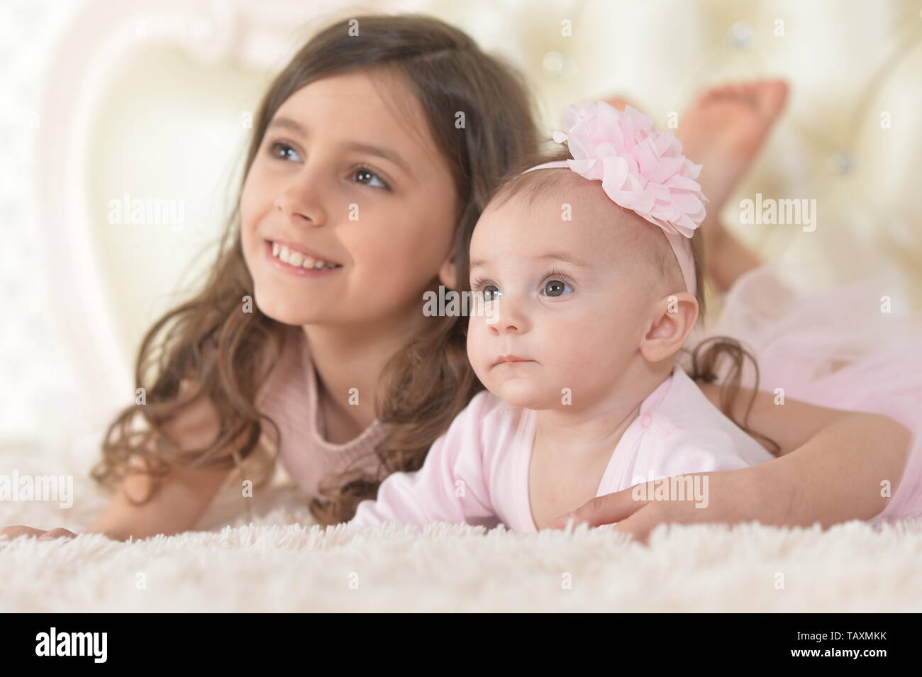 Close-up portrait of two beautiful cute sisters Stock Photo - Alamy