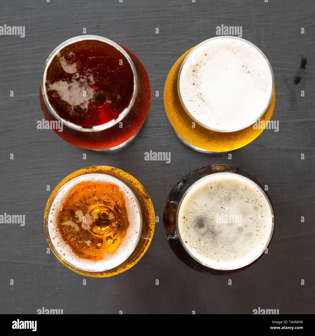 Assorted beers on a black background, top view. Overhead, from above ...