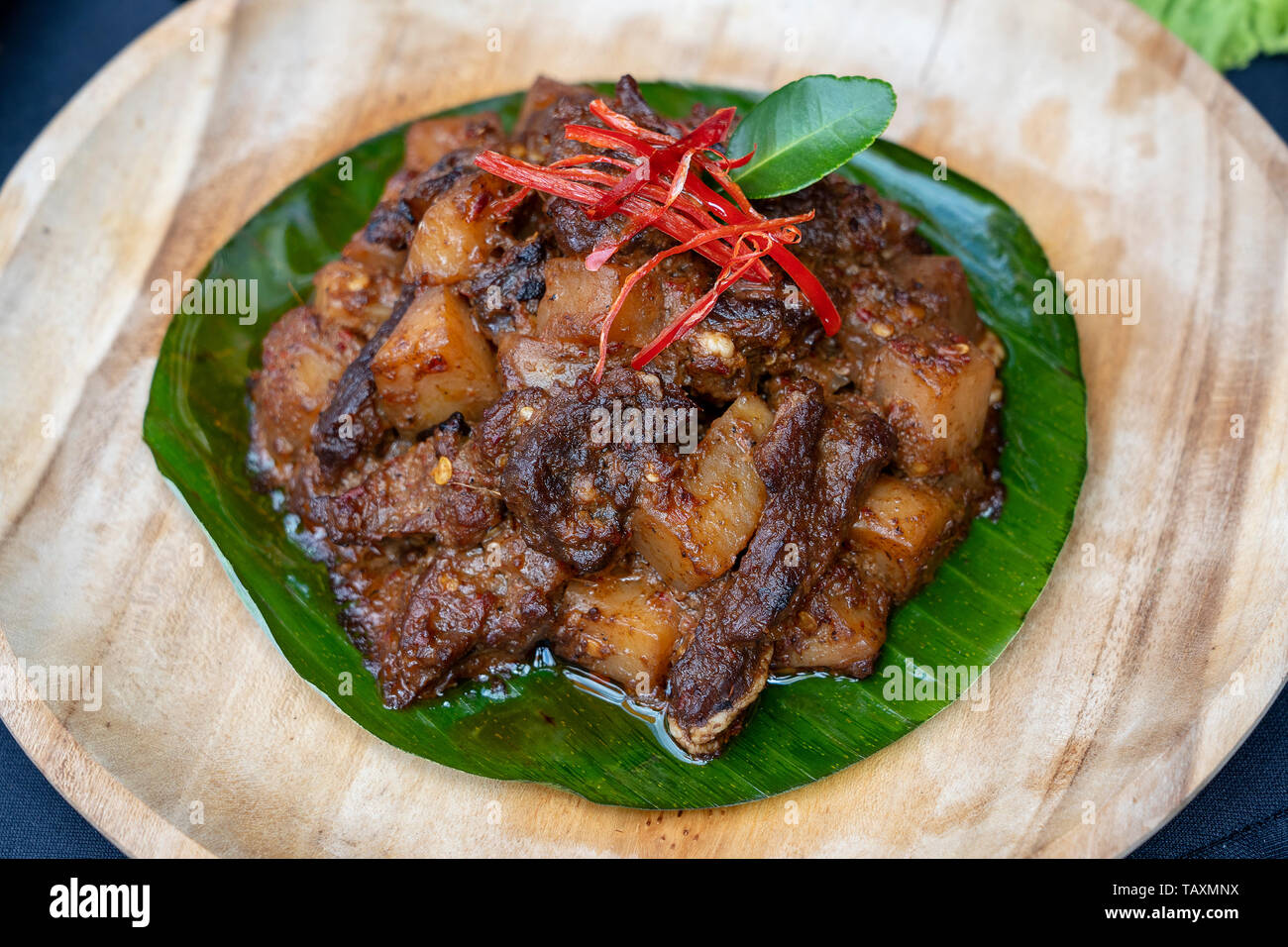 Indonesian dish - fried meat in chili sauce, close up Stock Photo - Alamy