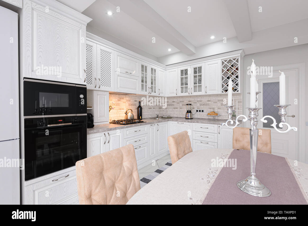 modern white wooden kitchen interior Stock Photo - Alamy