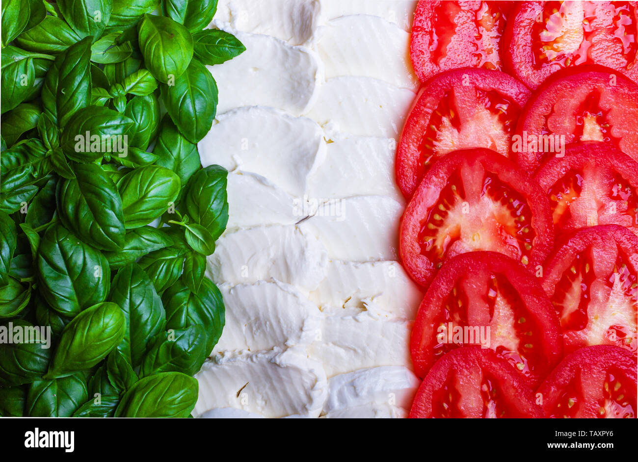 Fresh mozzarella and tomatoes and basil. Italian flag. Italian cuisine ...