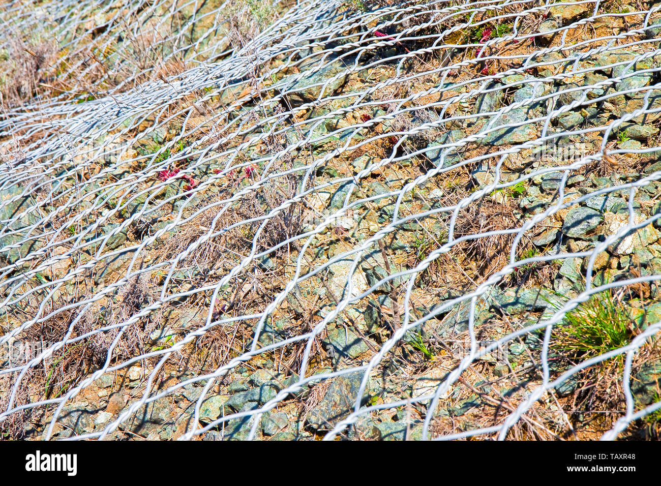 Protection wire mesh against falling rocks from the mountains Stock ...