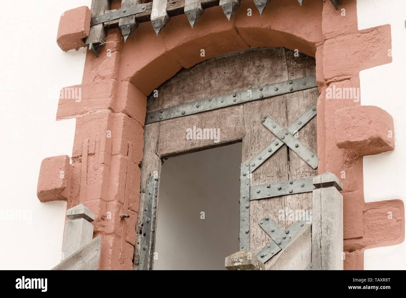 Medieval wooden door of a castle with red decorations (Germany, Europe ...